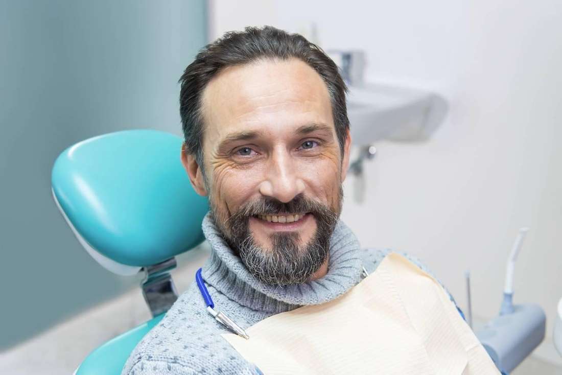 Am I a Candidate for Hybrid Dentures? | A Guide from Moore Smiles